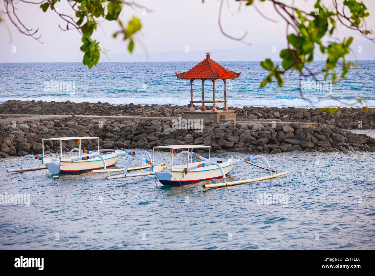 Traditional Boats Anchored off a Stone Jetty in Bali, Indonesia Stock ...