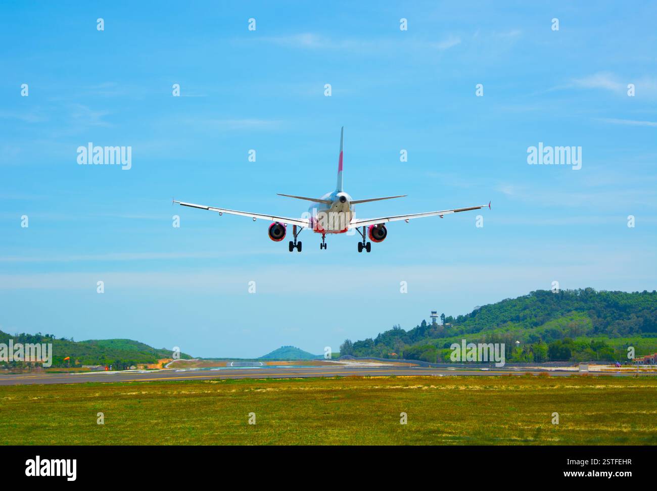 Twin-engine, modern, commercial airliner coming for a landing at an ...