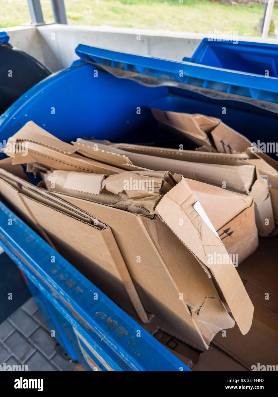 Recycling bin with discarded cardboard waste for sustainable waste ...