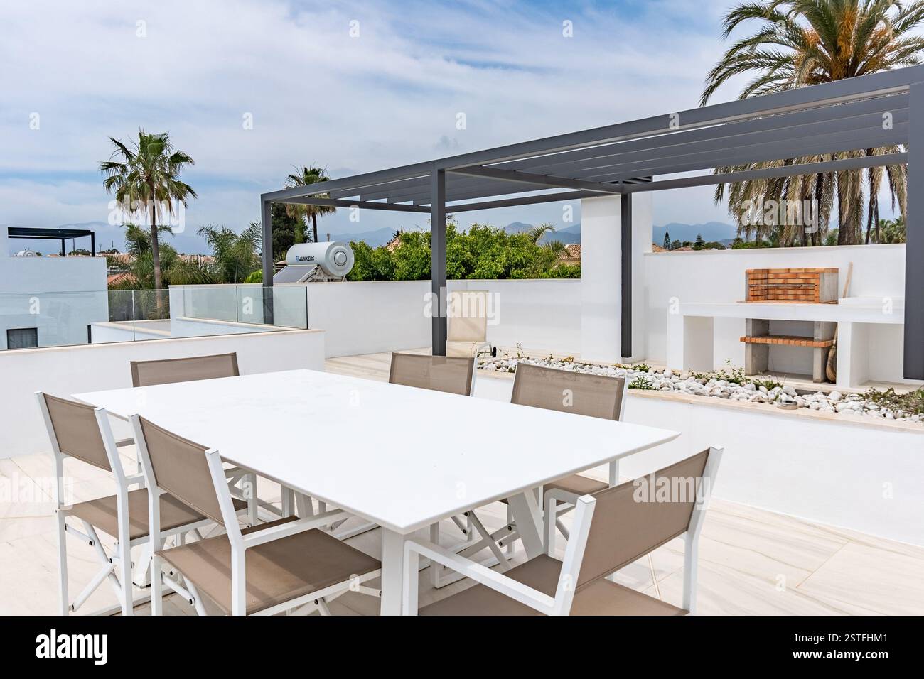 an image of a private rooftop terrace with outdoor dining table and ...