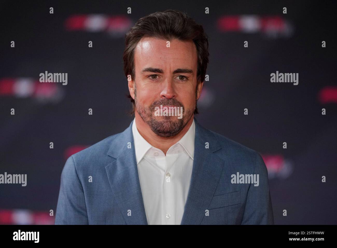 Aston Martin driver Fernando Alonso of Spain poses for cameras as he arrives to the F1 75 Live ...