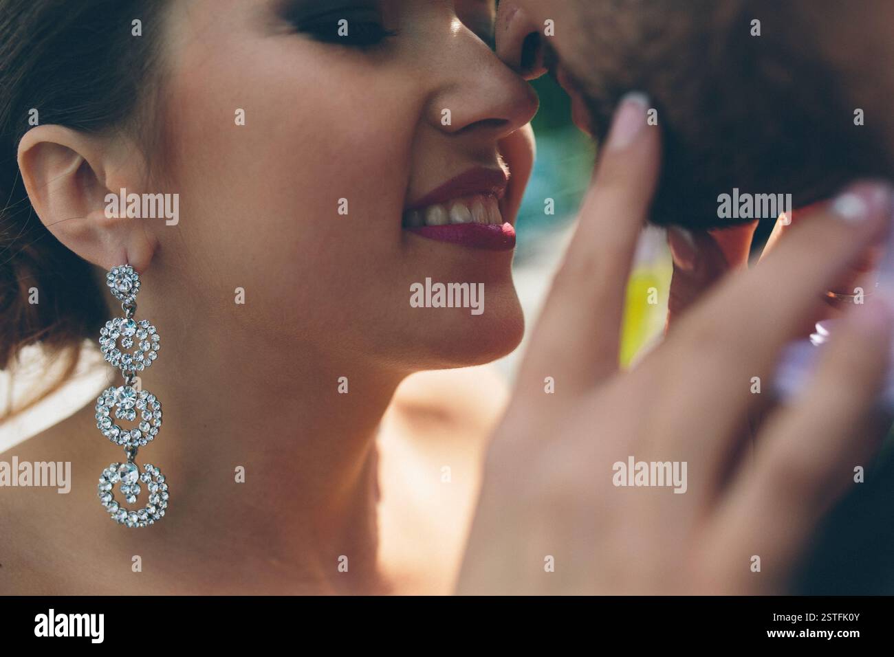 beautiful bride tenderly touched her future husband Stock Photo - Alamy