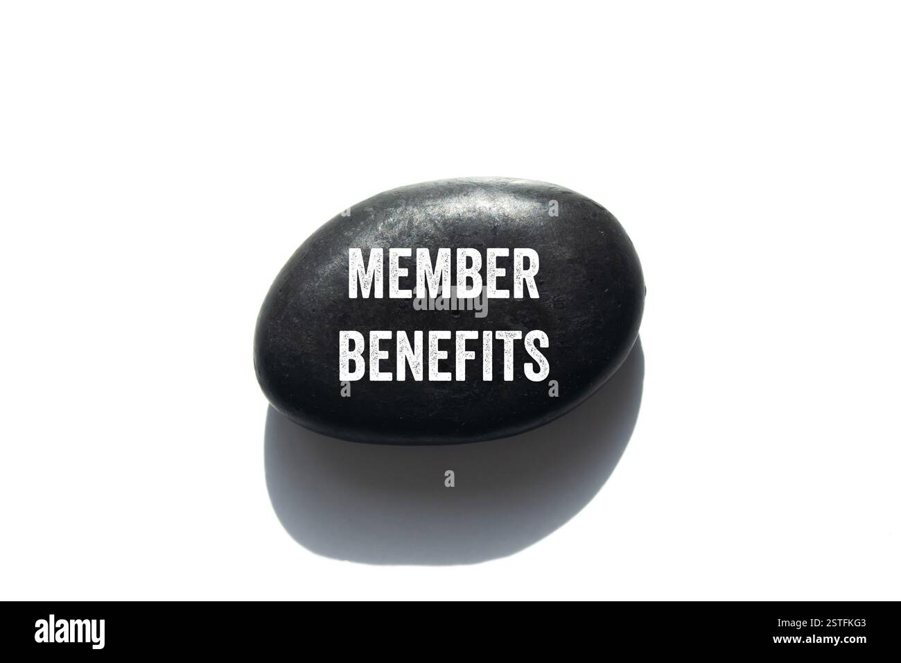 Member benefits message written on black stone on white background ...