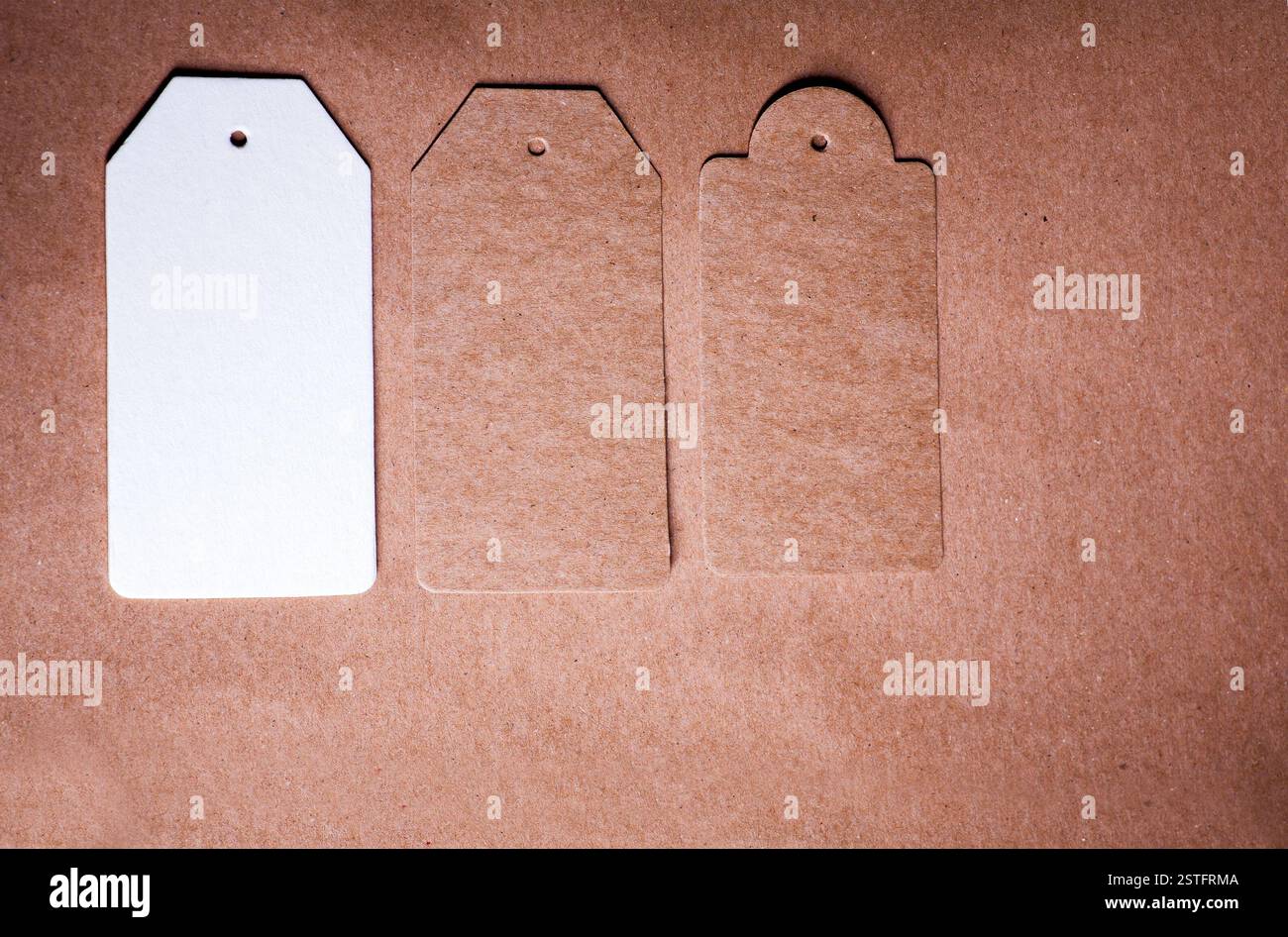 Three paper lable of different shape on craft paper background vintage ...