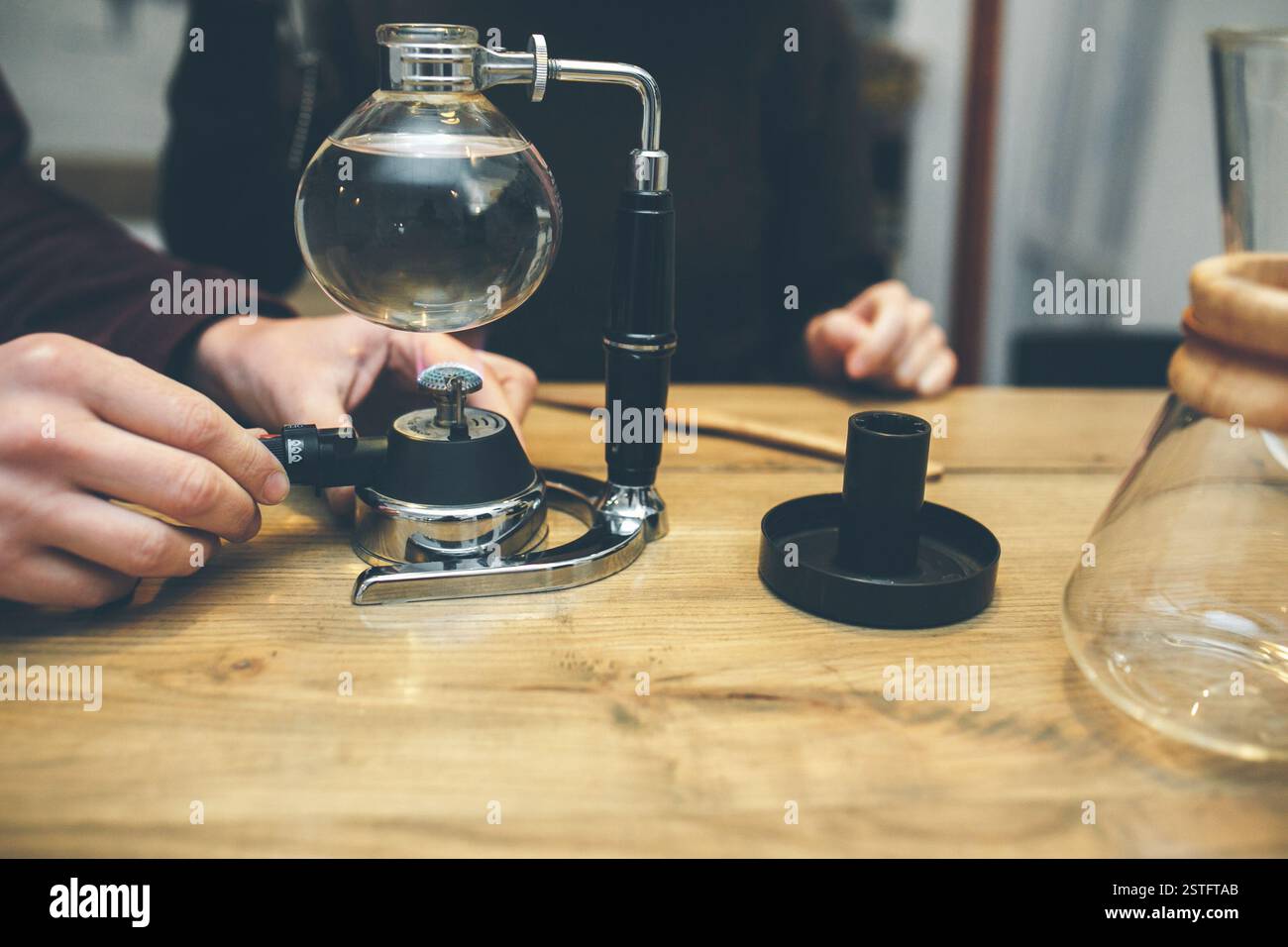 Vintage couple preparing coffee with vacuum coffee maker Stock Photo ...
