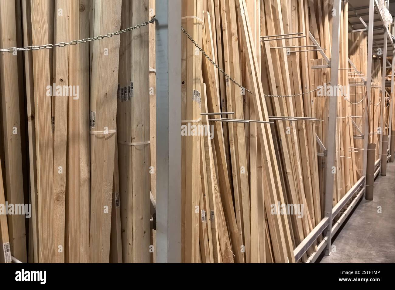 Rows of wooden planks stand tall and organized in a large home ...