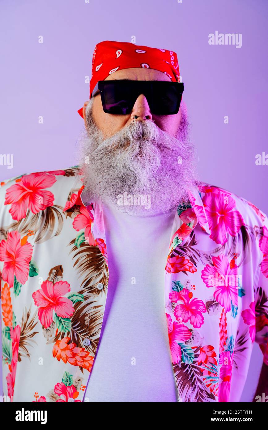 Senior old man with gray beard wearing hawaiian shirt portrait in ...