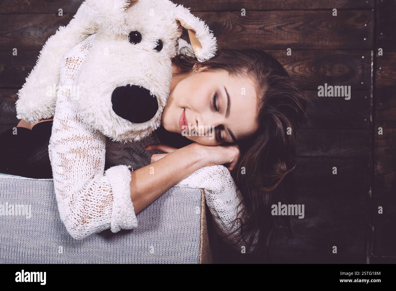 Cute girl hugging a cute toy Stock Photo - Alamy