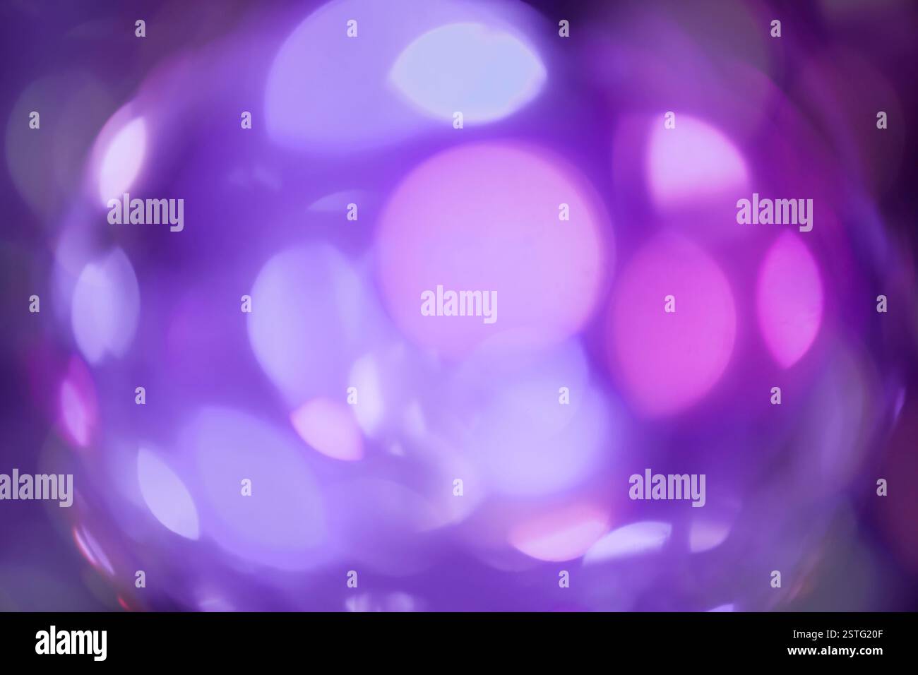 Abstract violet background with circles. Holiday pink bokeh. Defocused wallpaper Stock Photo - Alamy