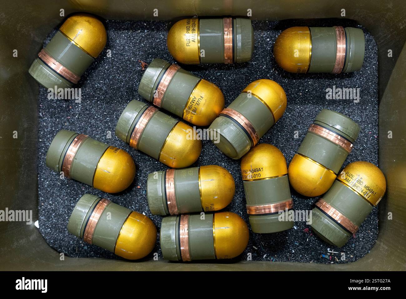 At a drone workshop, grenades are seen in a box, with their metal ...