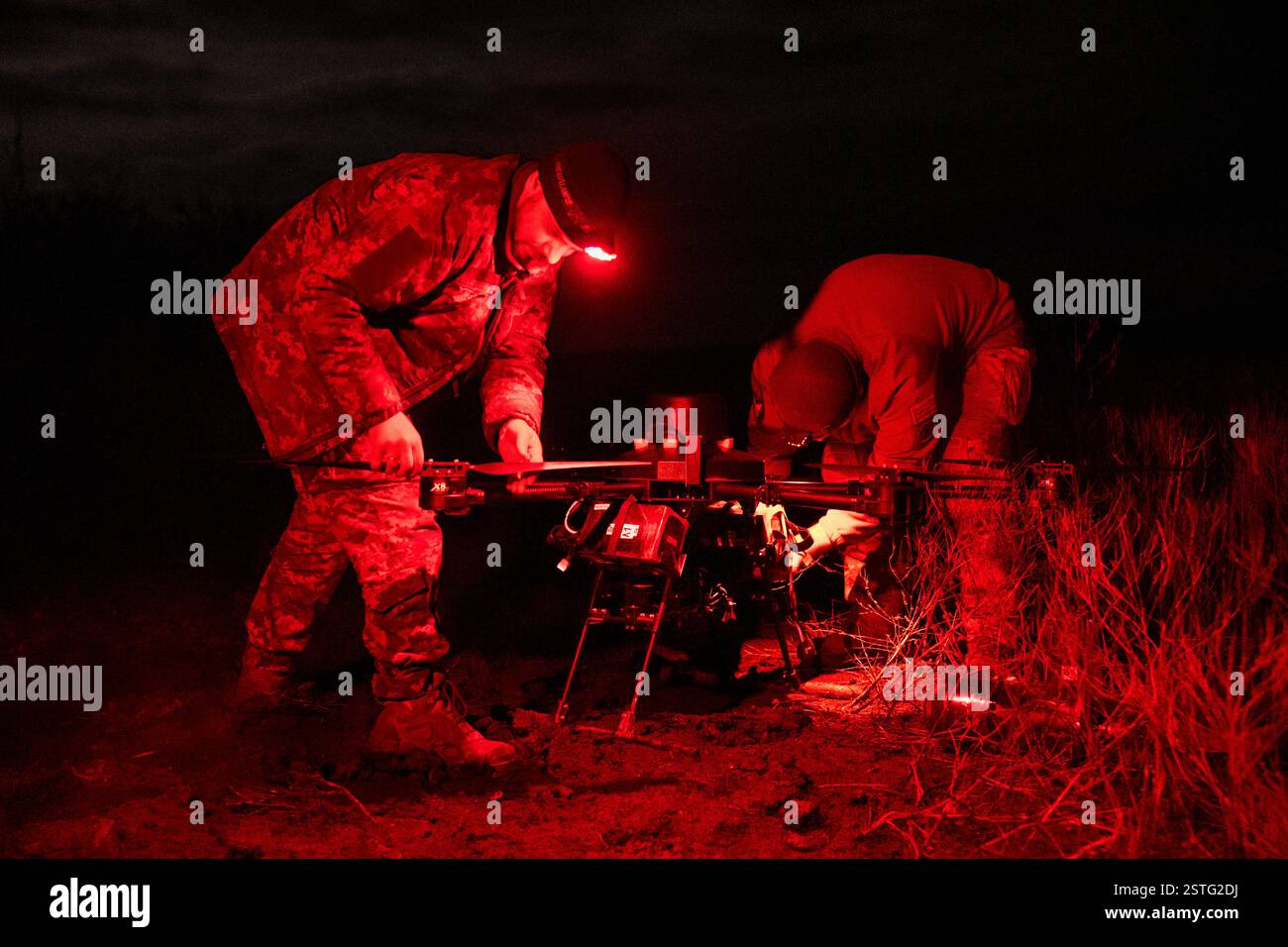 Ukrainian soldiers and drone operators set up a drone with a missile at ...