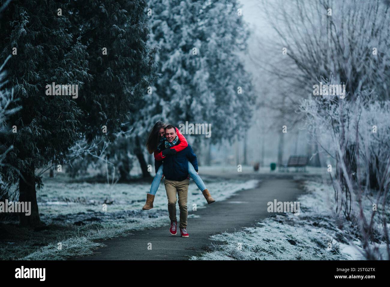 Man carries his girlfriend on back Stock Photo - Alamy