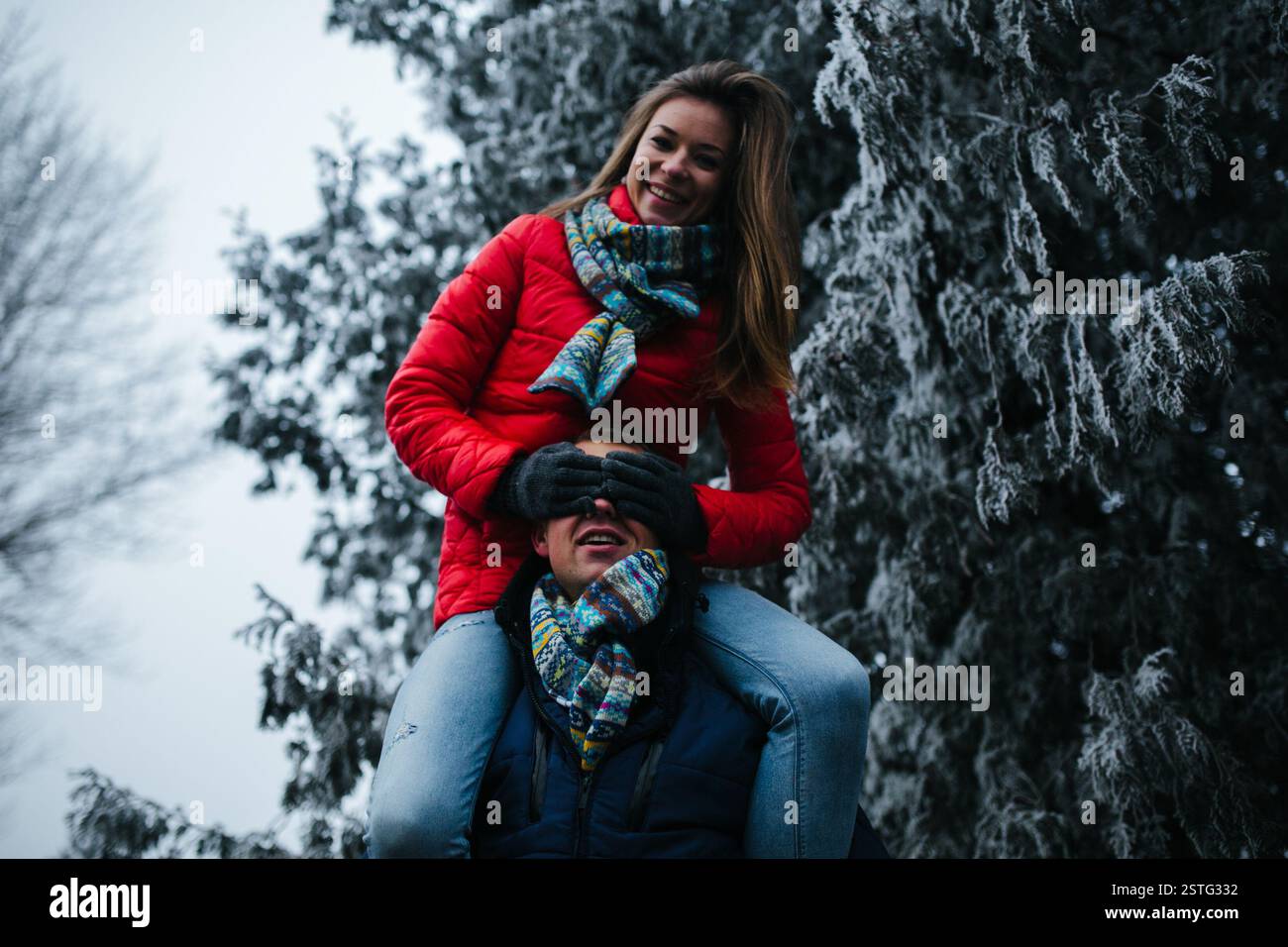 Man carries his girlfriend on back Stock Photo - Alamy