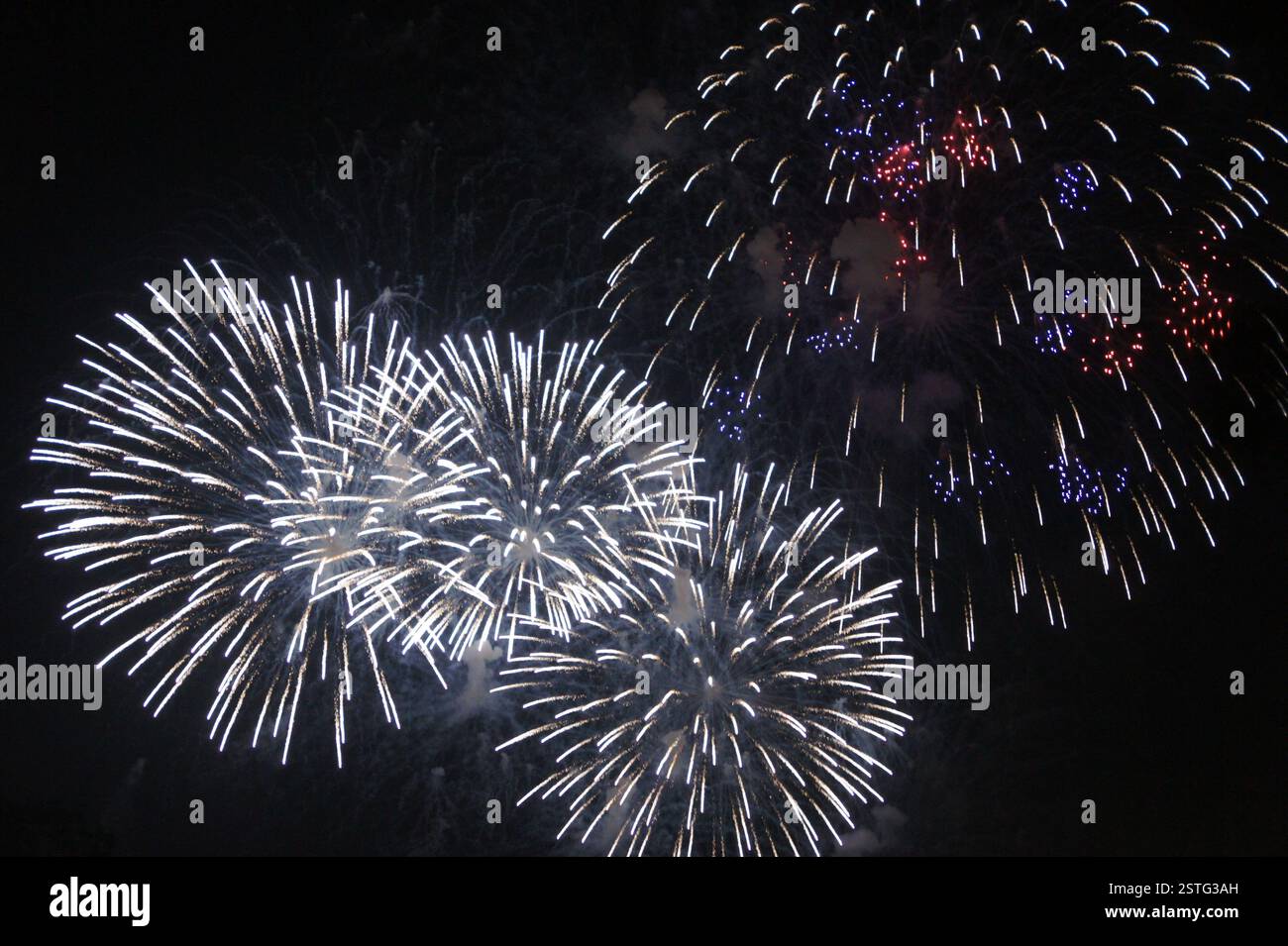 Boston fireworks bursting with colorful light against a night sky. A ...