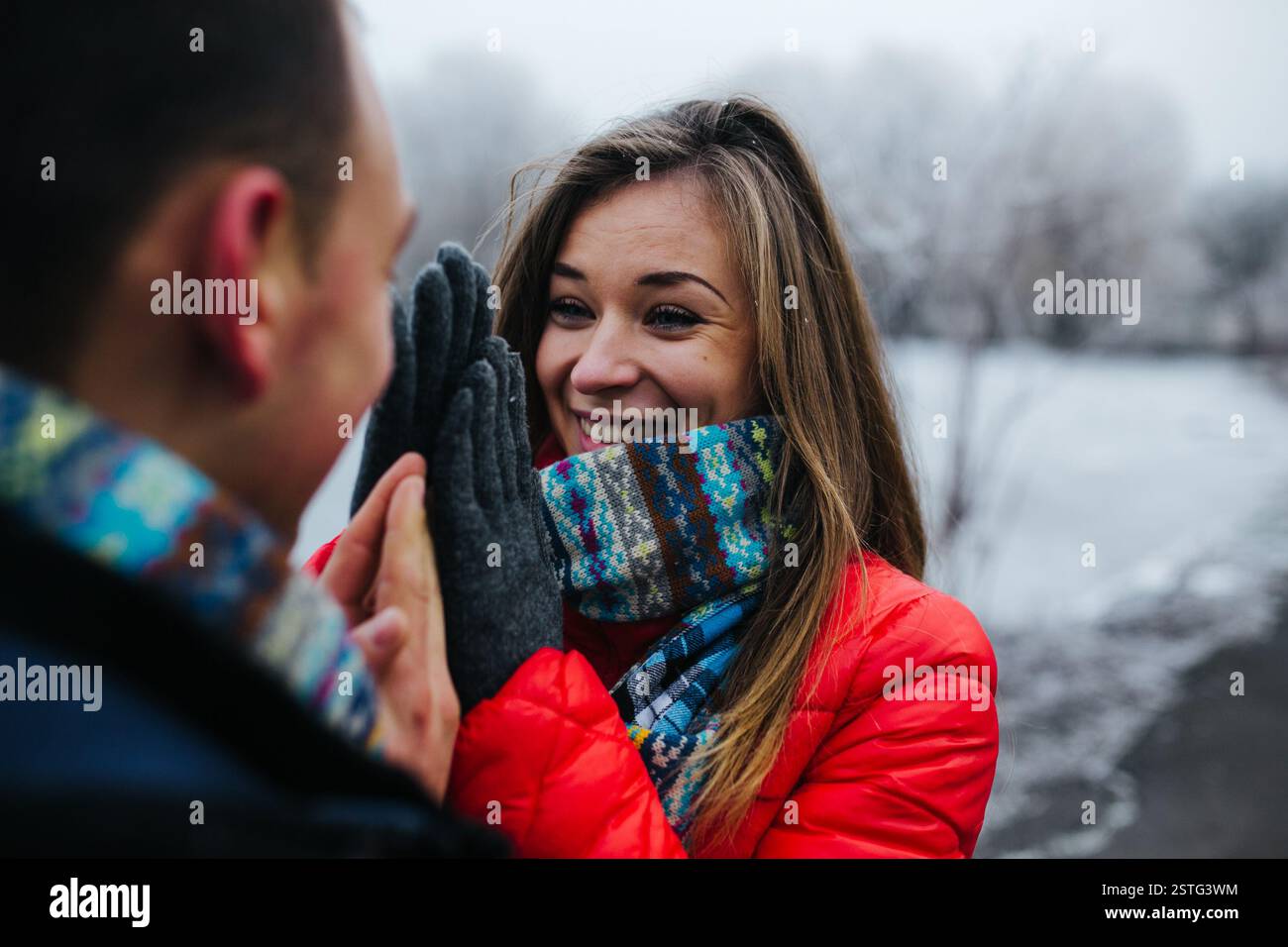 Young couple clapping hands hi-res stock photography and images - Alamy