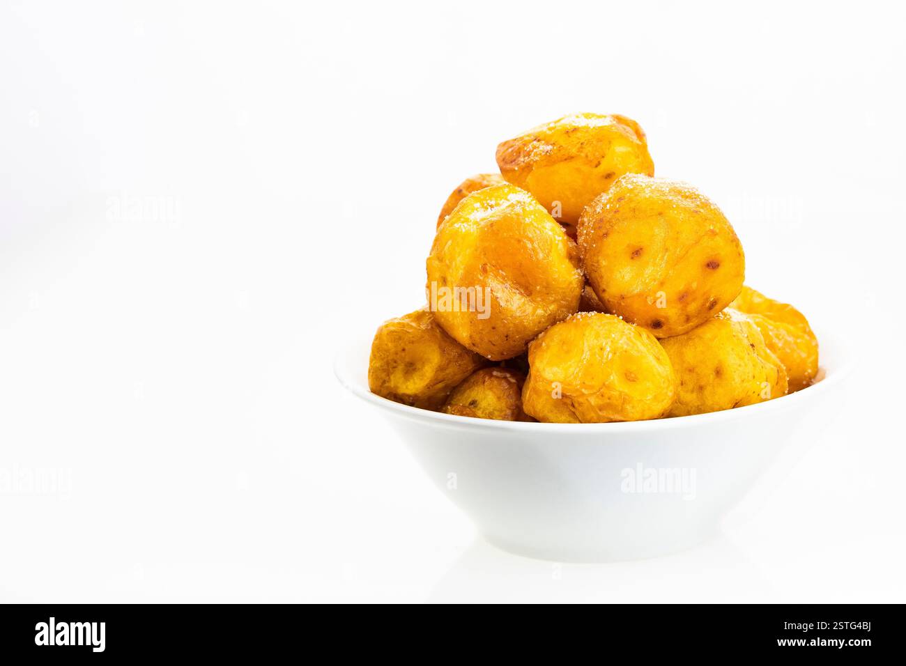Crispy fried creole potatoes with salt - Solanum phureja Stock Photo ...