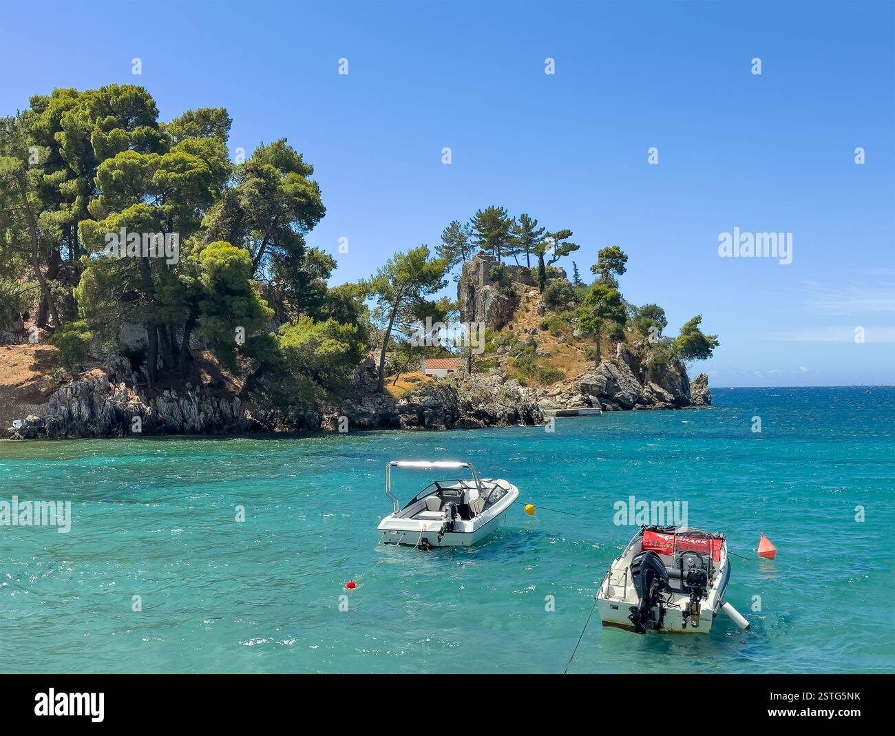 Parga, Greece - July 3, 2024: Motorboats in the azure Ionian Sea with ...