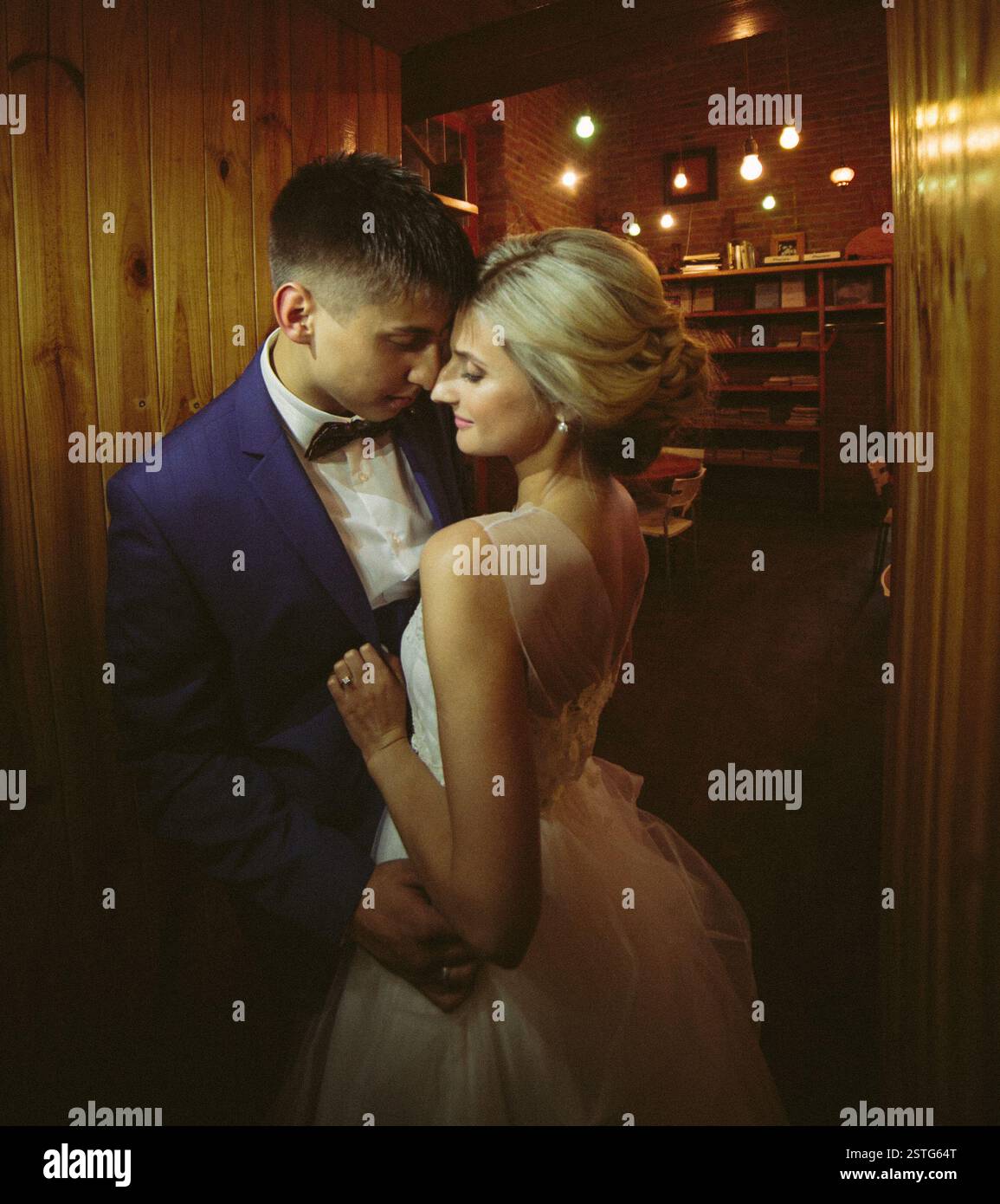 The bride and groom in a cozy house Stock Photo - Alamy