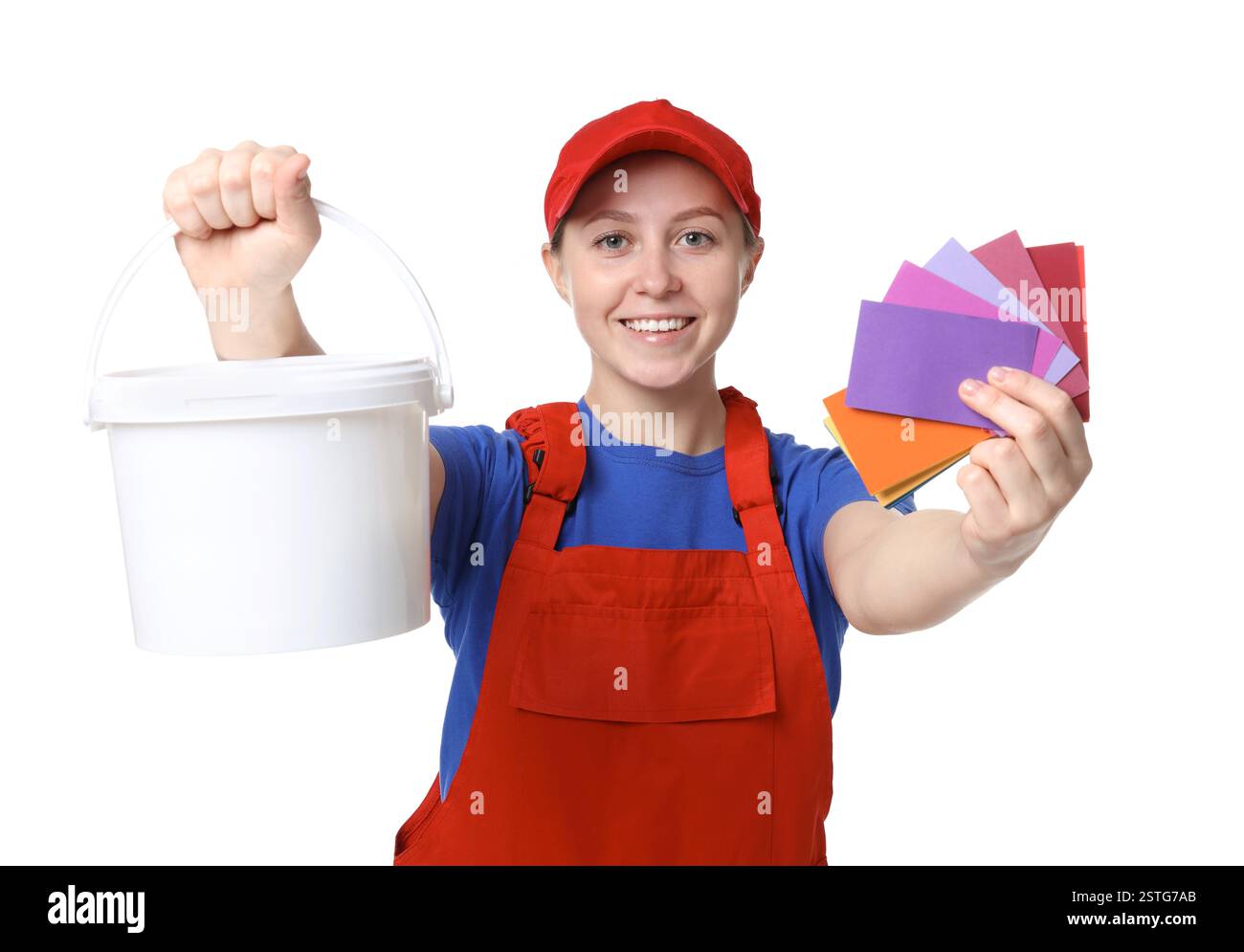 Professional painter with color samples and bucket of paint on white ...