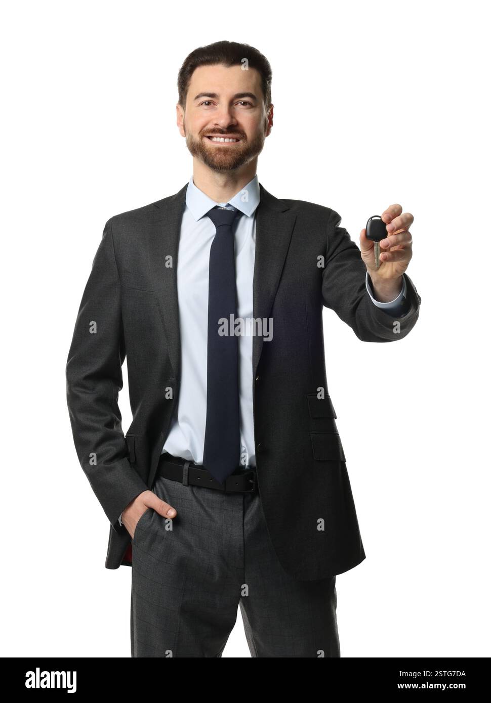 Cheerful salesman with car key on white background Stock Photo - Alamy