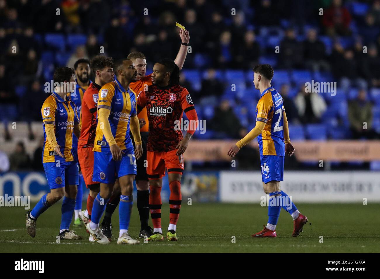 Shrewsbury, UK. 18th Feb, 2025. Callum Stewart of Shrewsbury Town is ...