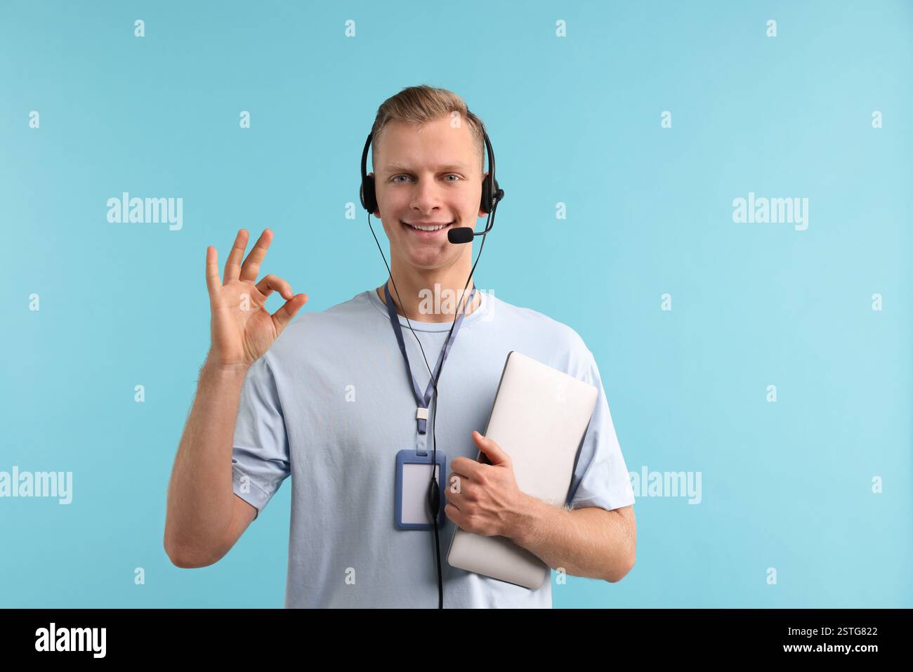 Technical support call center. Smiling operator with laptop showing ok ...
