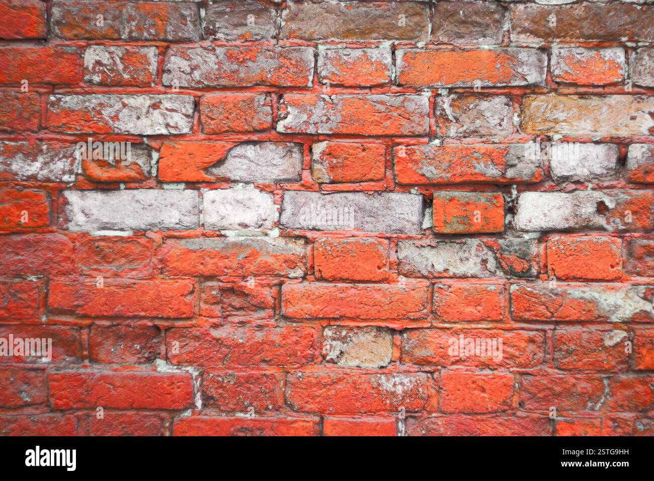 Weathered paint on red brick wall background with spots of salt Stock ...