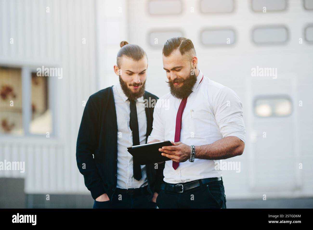 Businessmen standing face hi-res stock photography and images - Alamy