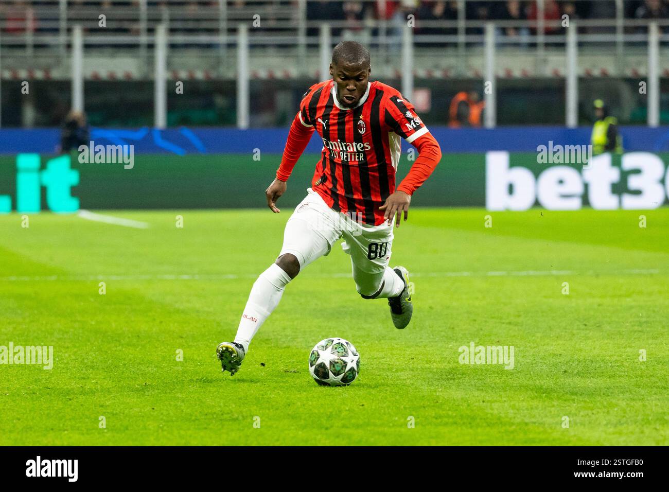 Yumus Musah in action during the UEFA Champions League 2024/25 match between AC Milan and ...