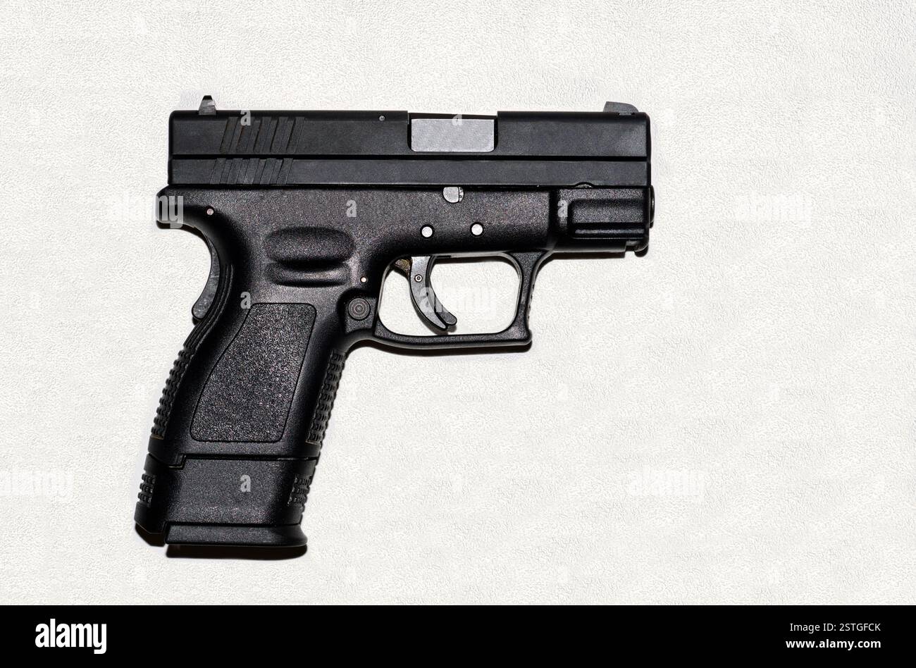 Compact semi automatic handgun isolated on white side view Stock Photo ...