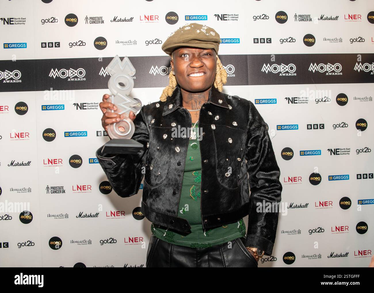 Newcastle, United Kingdom. 18th February 2025. Darkoo llfts two trophys ...