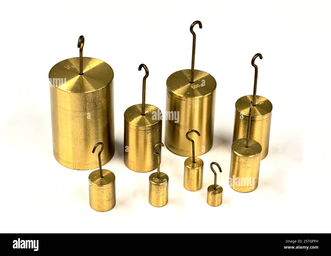 Brass hooked weights scientific laboratory measuring equipment isolated ...