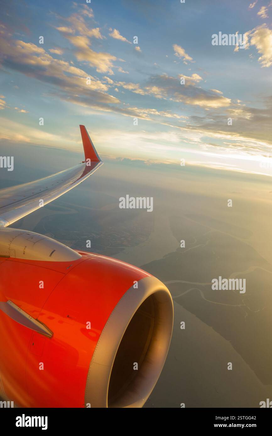 Airliner in flight at sunset Stock Photo - Alamy
