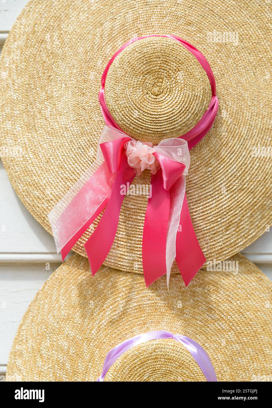 Straw hats with ribbons Stock Photo - Alamy
