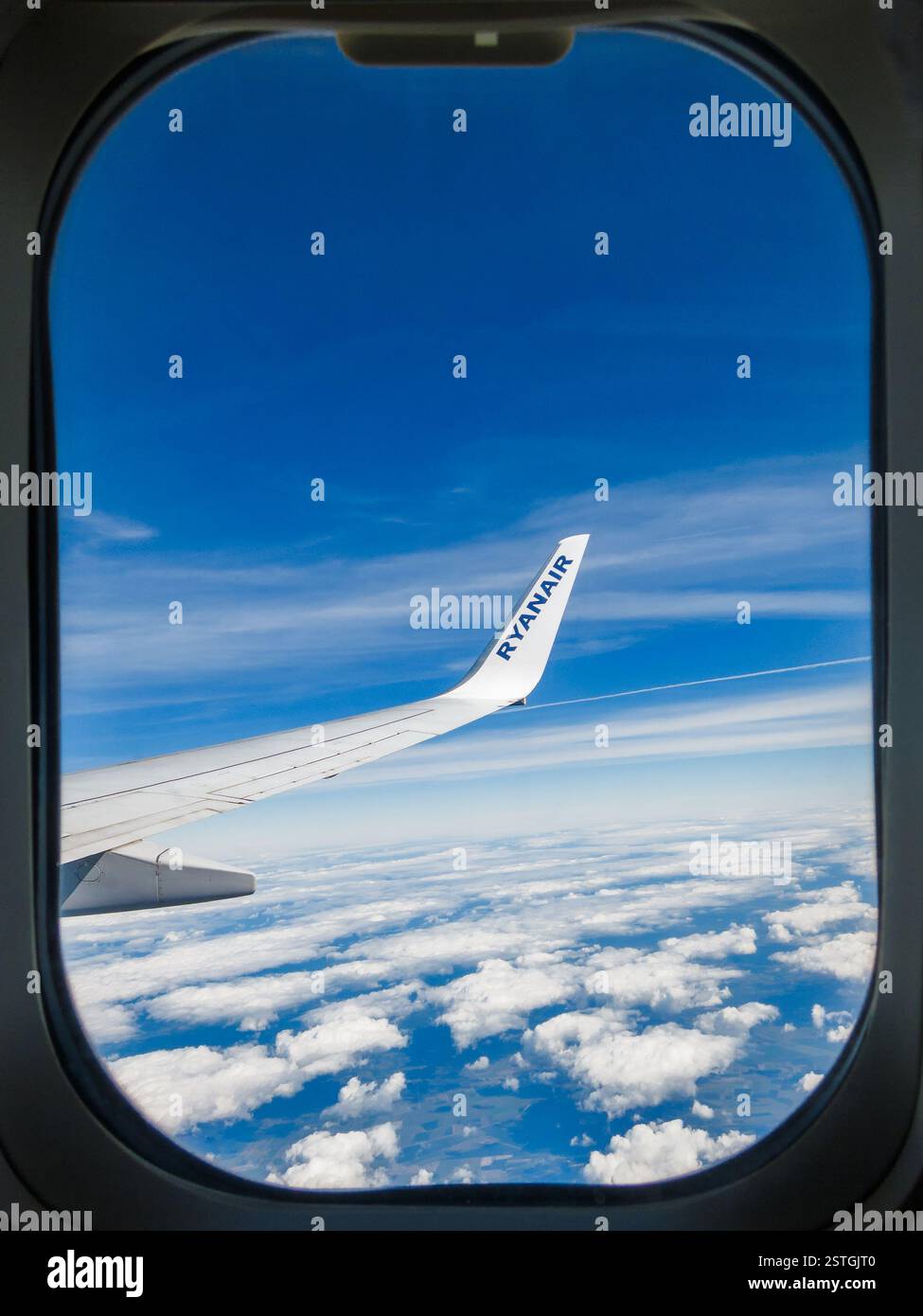 Ryanair wing detail, window frame, airplane in flight Stock Photo - Alamy