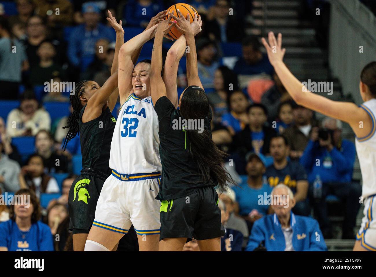 UCLA Bruins forward Angela Dugalic (32) is trapped by Michigan State ...