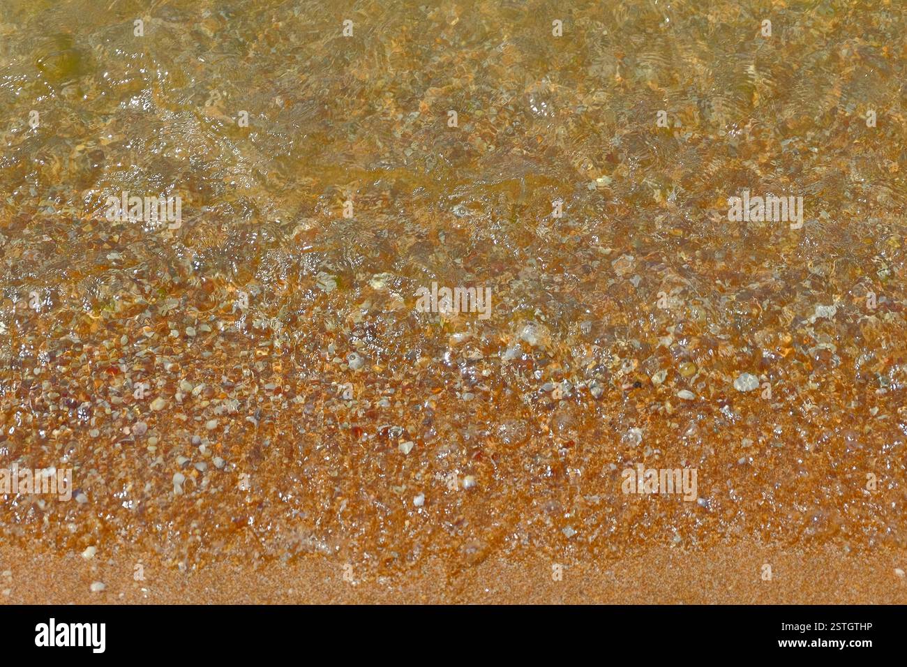 Wave Transparent Sea Water over Sand beach with Small Pebbles Top View ...