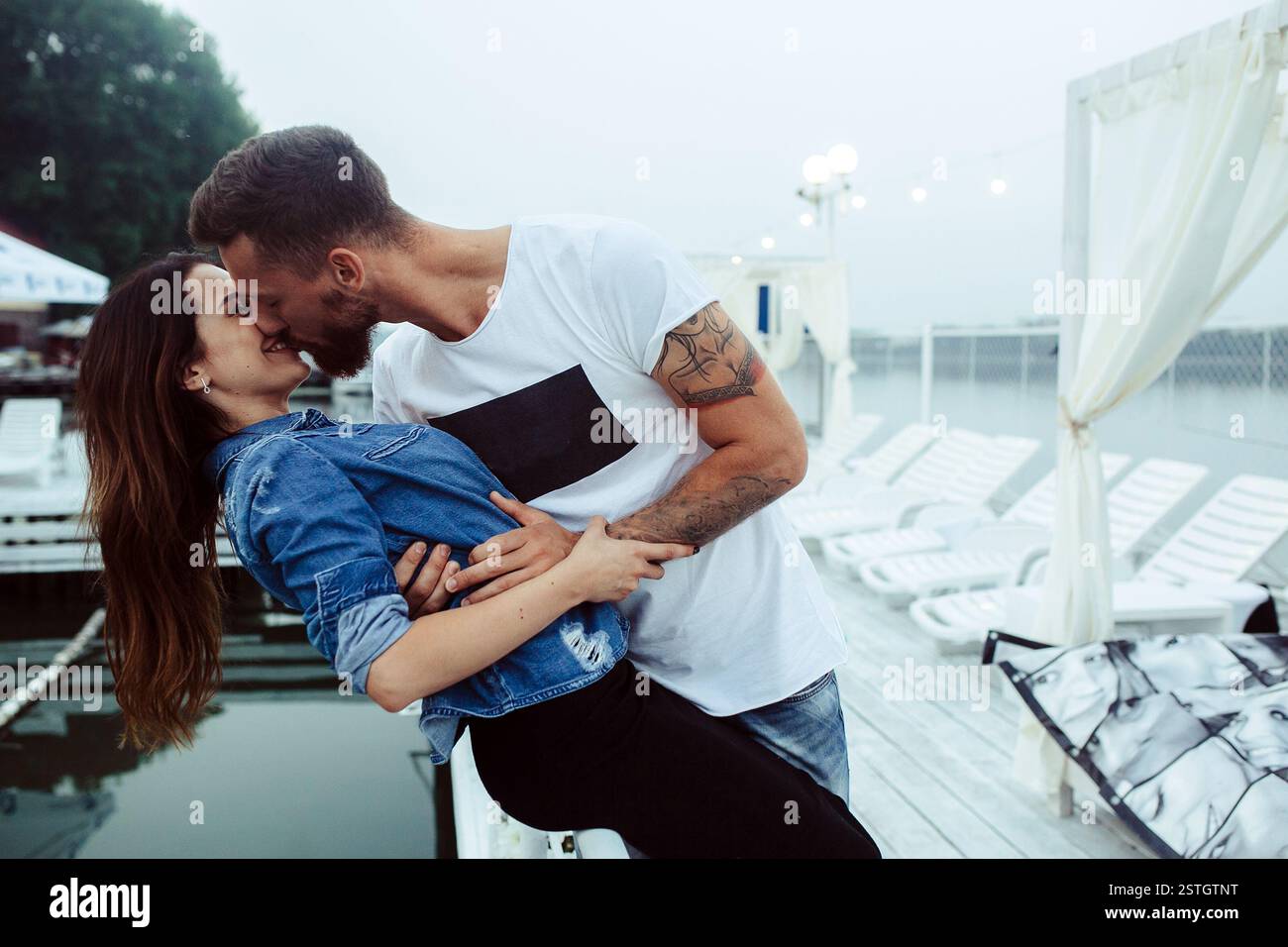 Beautiful woman kissing man hi-res stock photography and images - Alamy