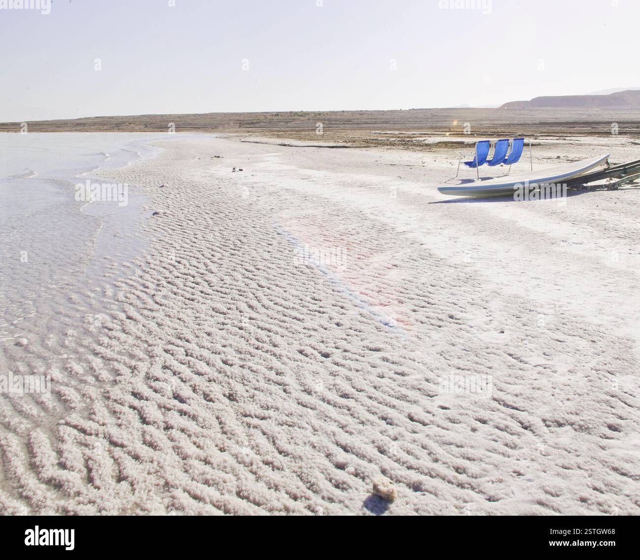 A breathtaking view of the Dead Sea’s turquoise waters and white salt ...