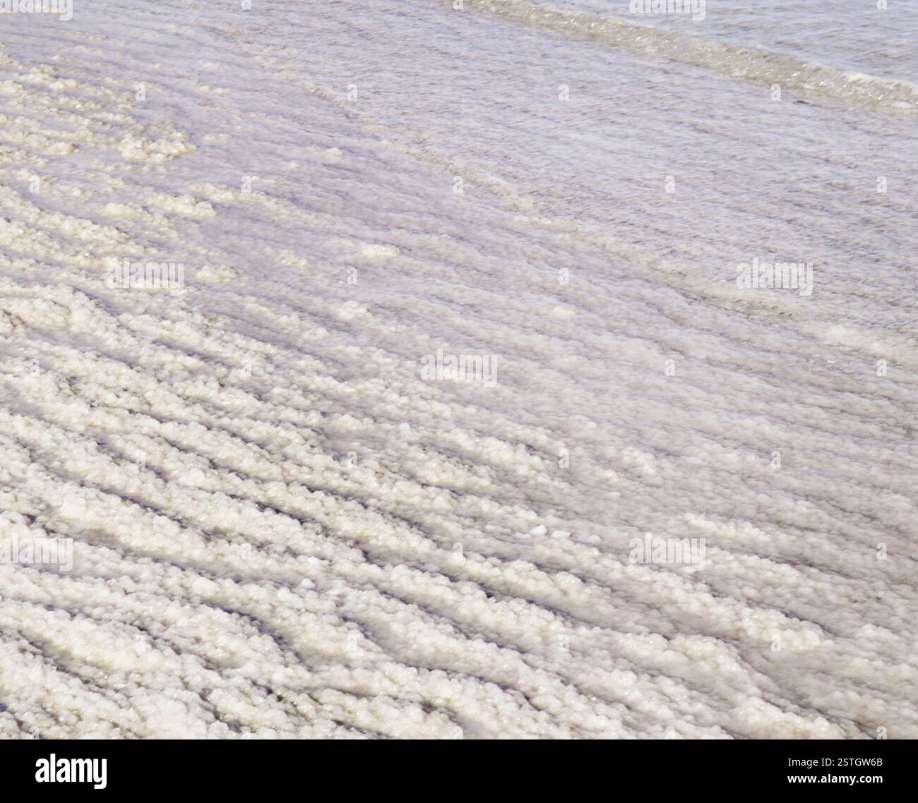 Stunning salt crystal formations along the shore of the Dead Sea, a ...