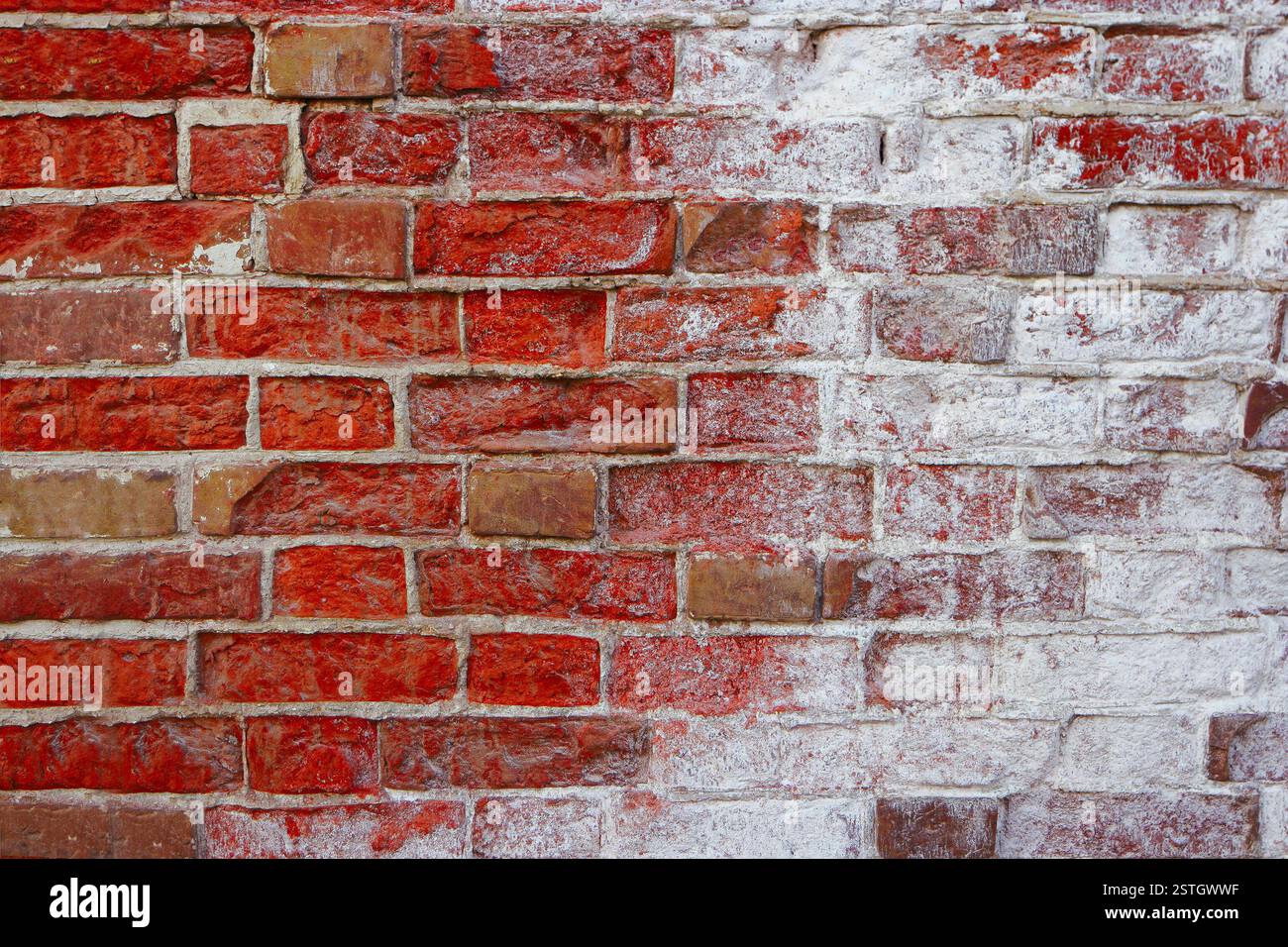 Old cracked wall half red half white background hi-res stock ...