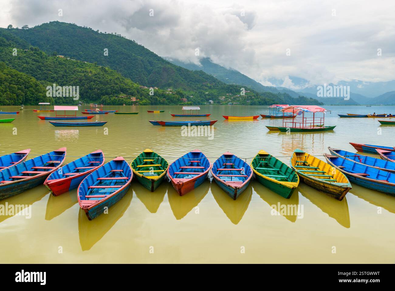 Colorful small boats on Phewa Lake in Pokhara, Nepal Stock Photo - Alamy