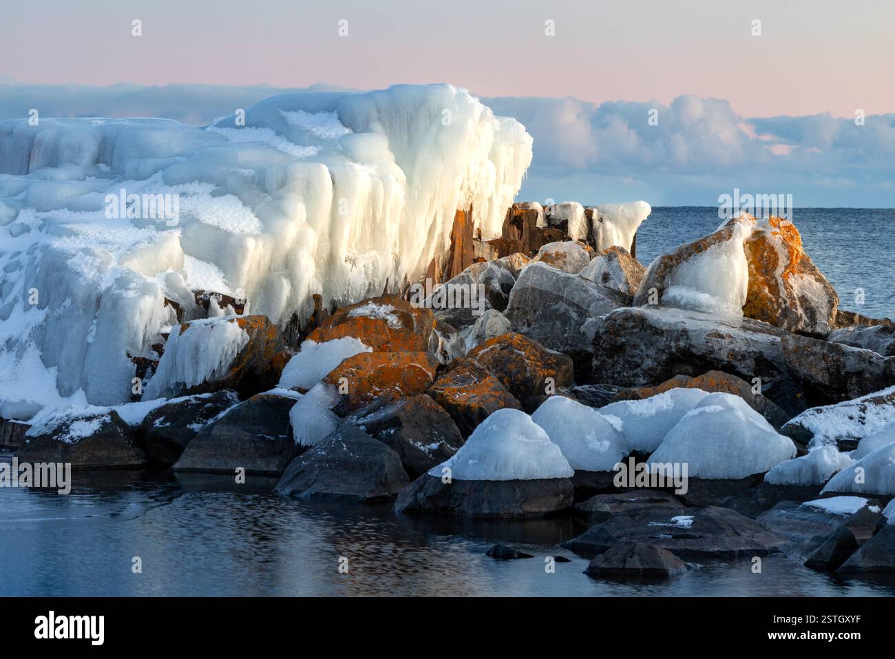 Winter ice on the harbor breaker wall of Lake Superior in Grand Marais ...