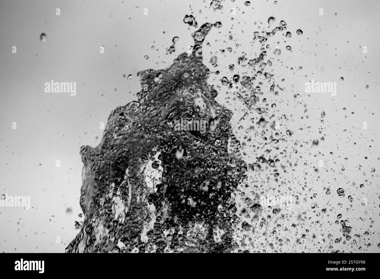 Water splash in the air in front of dark sky hi-res stock photography ...