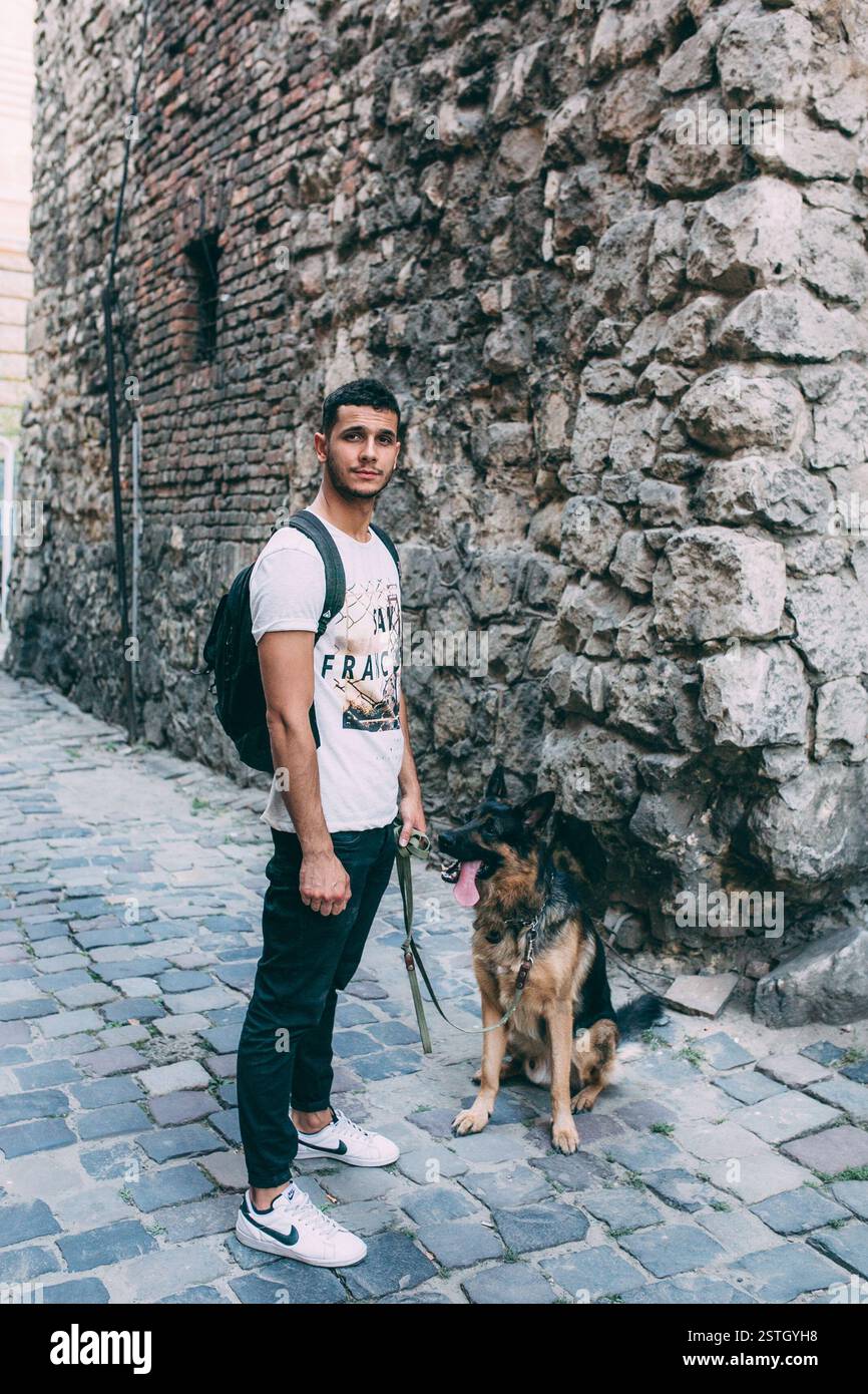 Man dog street hi-res stock photography and images - Alamy