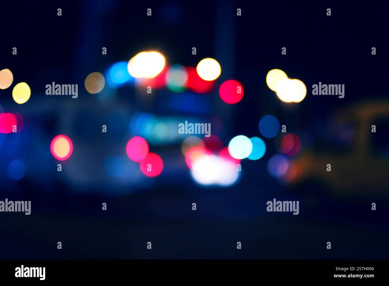Colorized blurred street and car lights, urban abstract night time ...