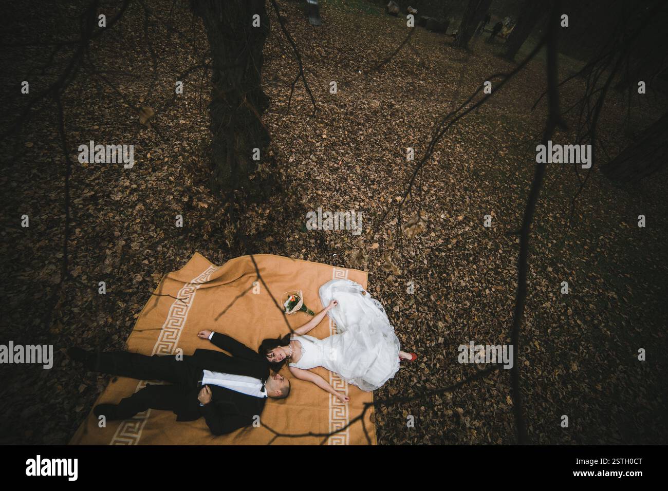 Couple lying down Stock Photo - Alamy