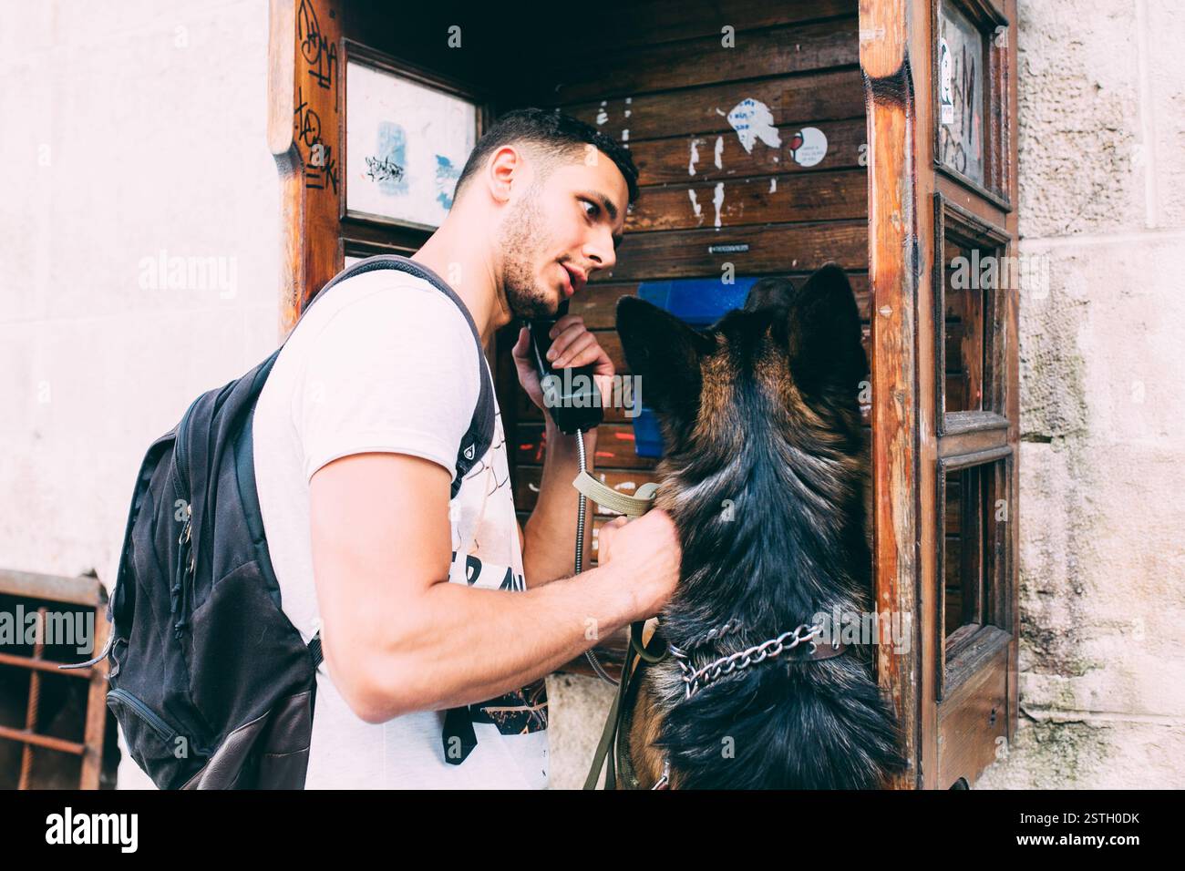 Man and dog at a pay phone Stock Photo - Alamy