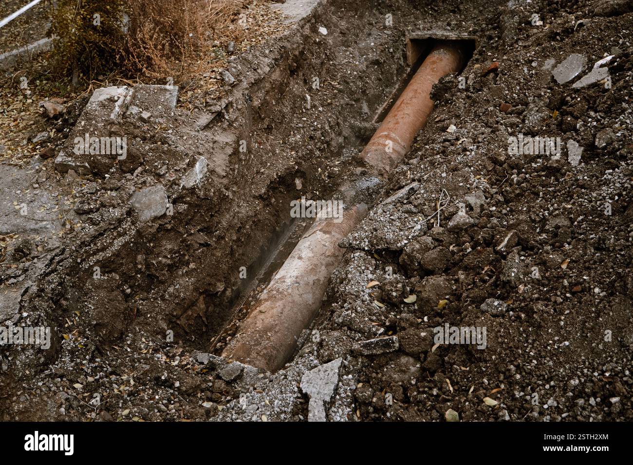 Old Rusty Pipe for water in a trench open for repair top view Stock ...