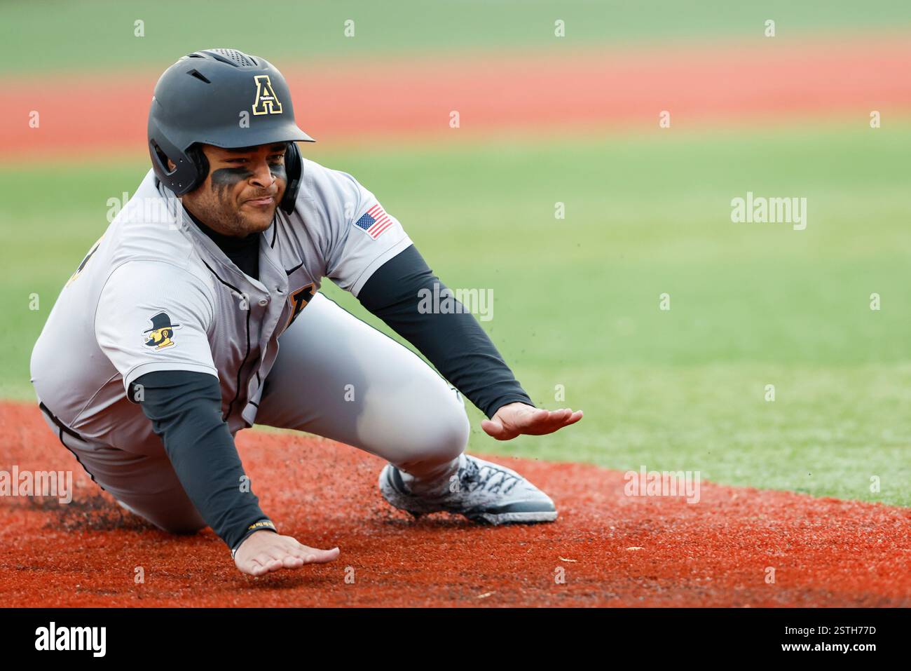 Appalachian State baserunner Kameron Miller slides safely into third ...